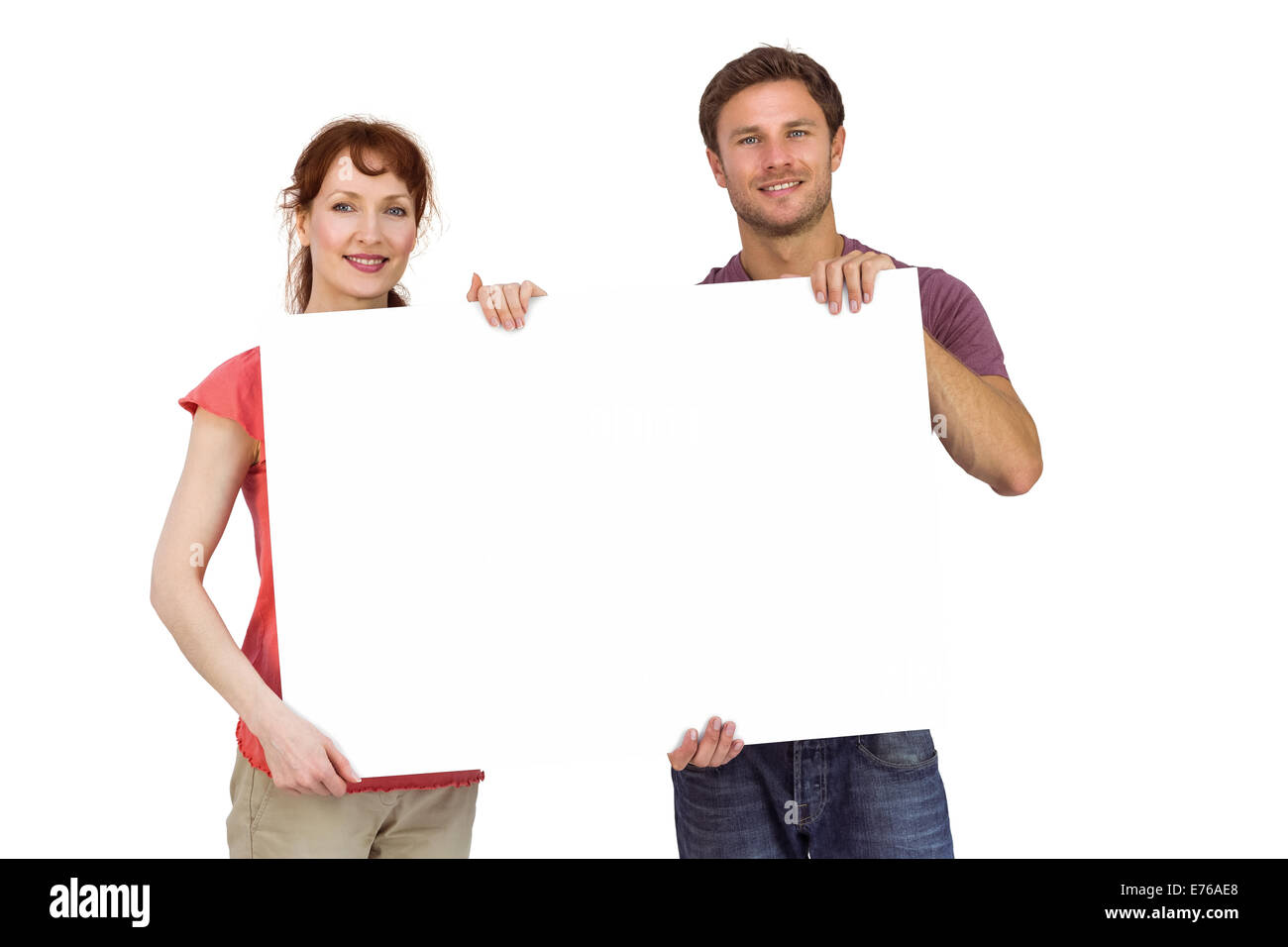 Couple holding a white sign Stock Photo - Alamy