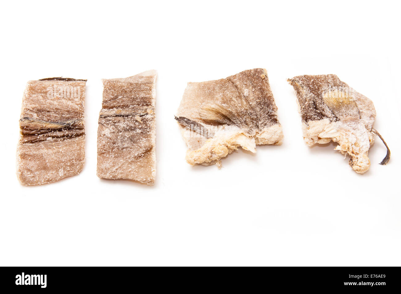 Pieces of salt cod fish isolated on a white studio background Stock ...
