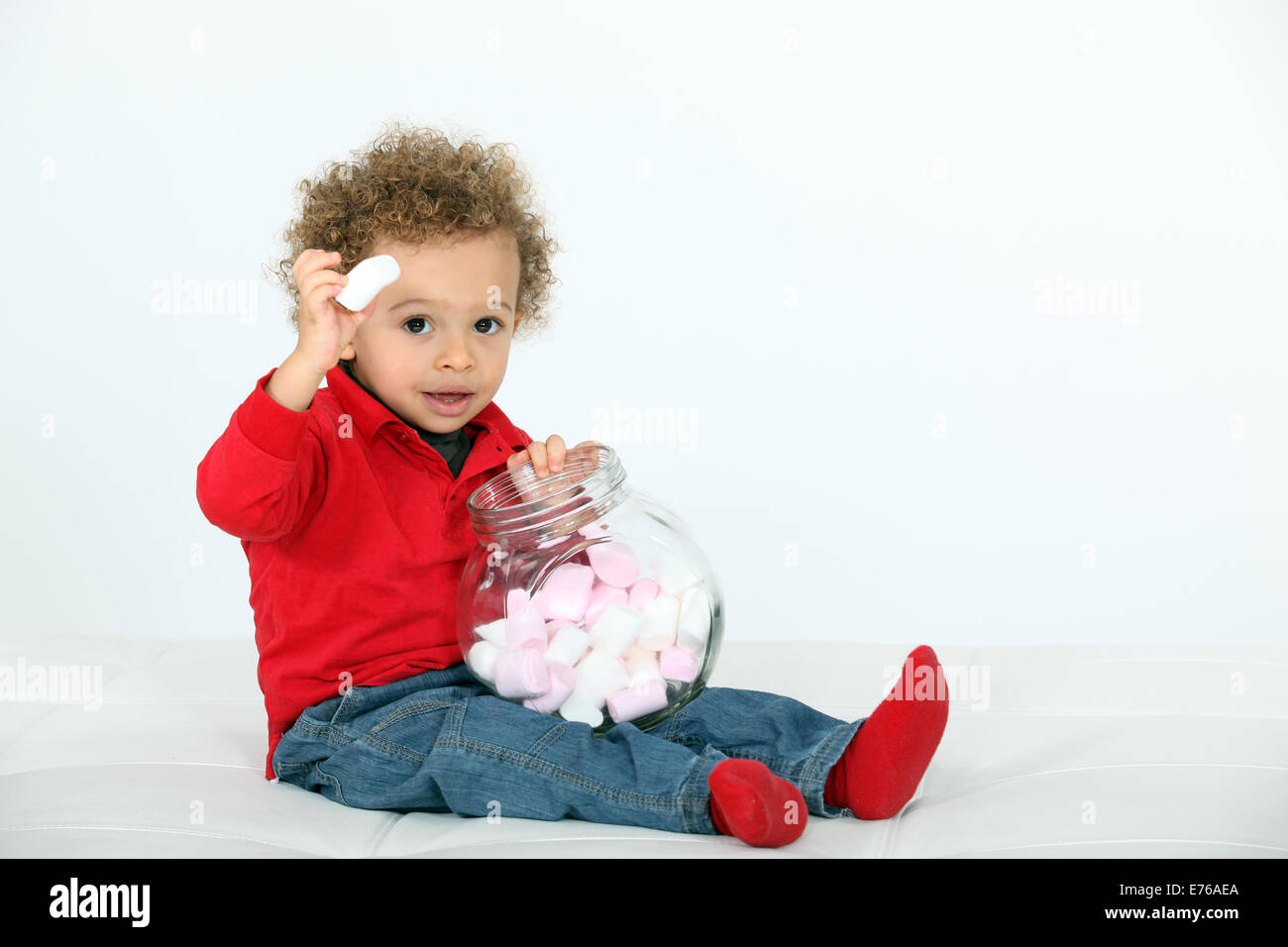 Little boy with bowl of marshmallows Stock Photo - Alamy