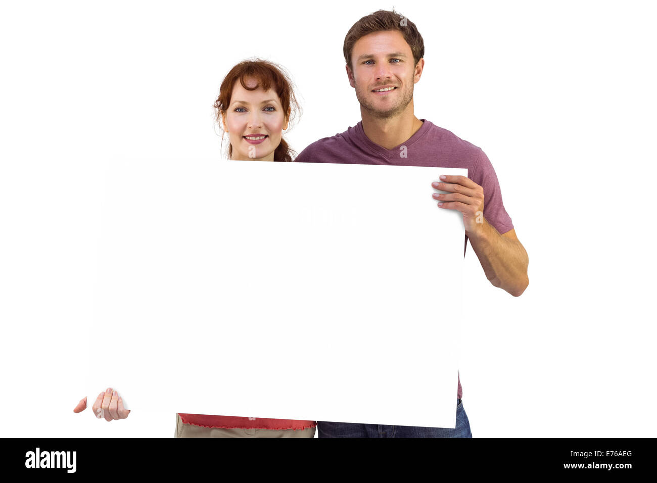 Couple holding a white sign Stock Photo - Alamy