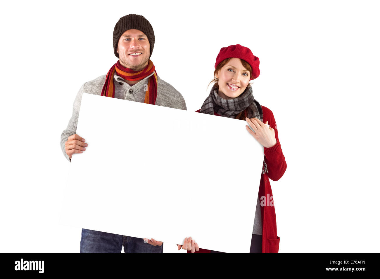 Couple holding a large sign Stock Photo - Alamy