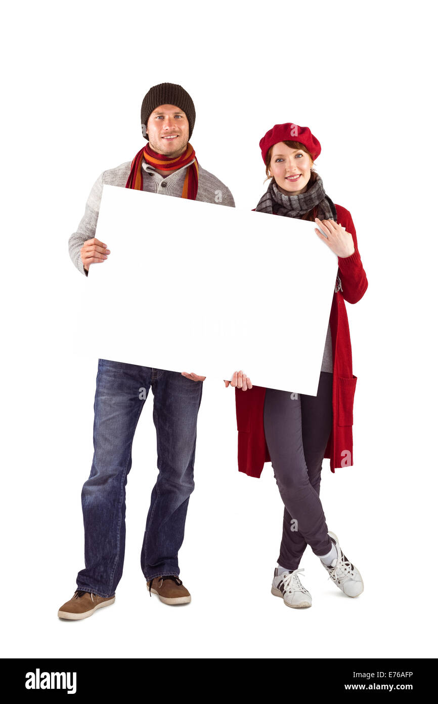 Couple holding a large sign Stock Photo - Alamy