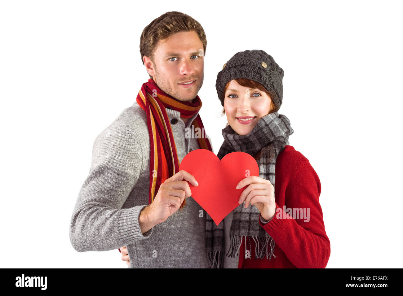 Couple holding a red heart Stock Photo - Alamy