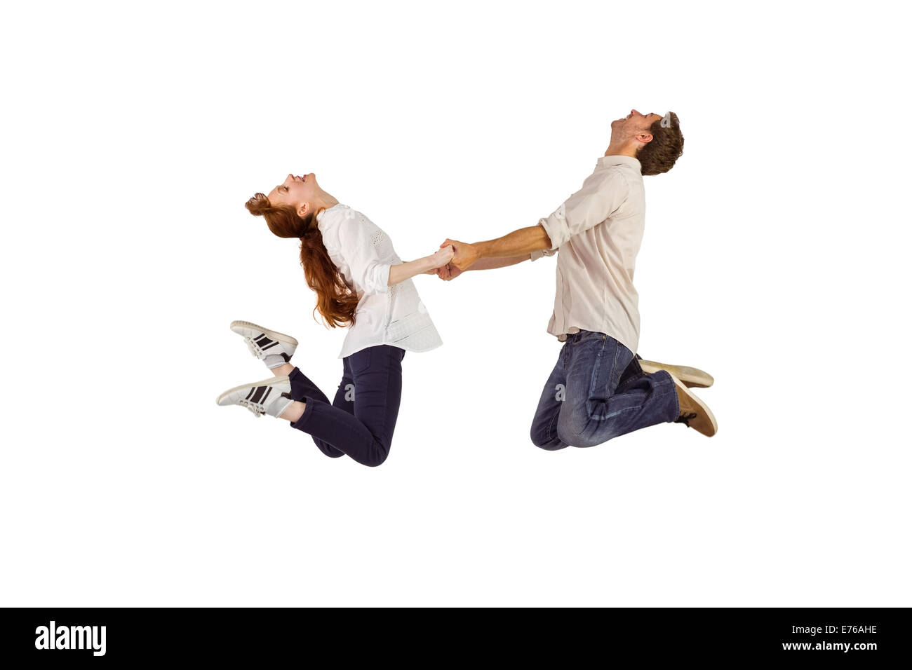 Couple jumping and holding hands Stock Photo - Alamy