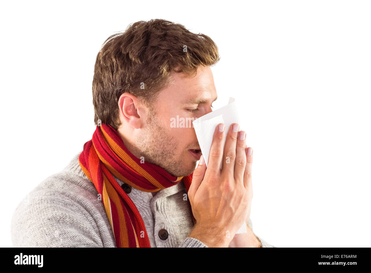 Man blowing nose on tissue Stock Photo - Alamy