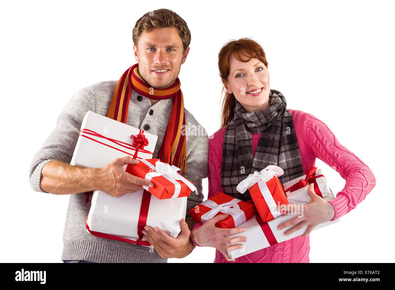 Couple holding lots of presents Stock Photo - Alamy