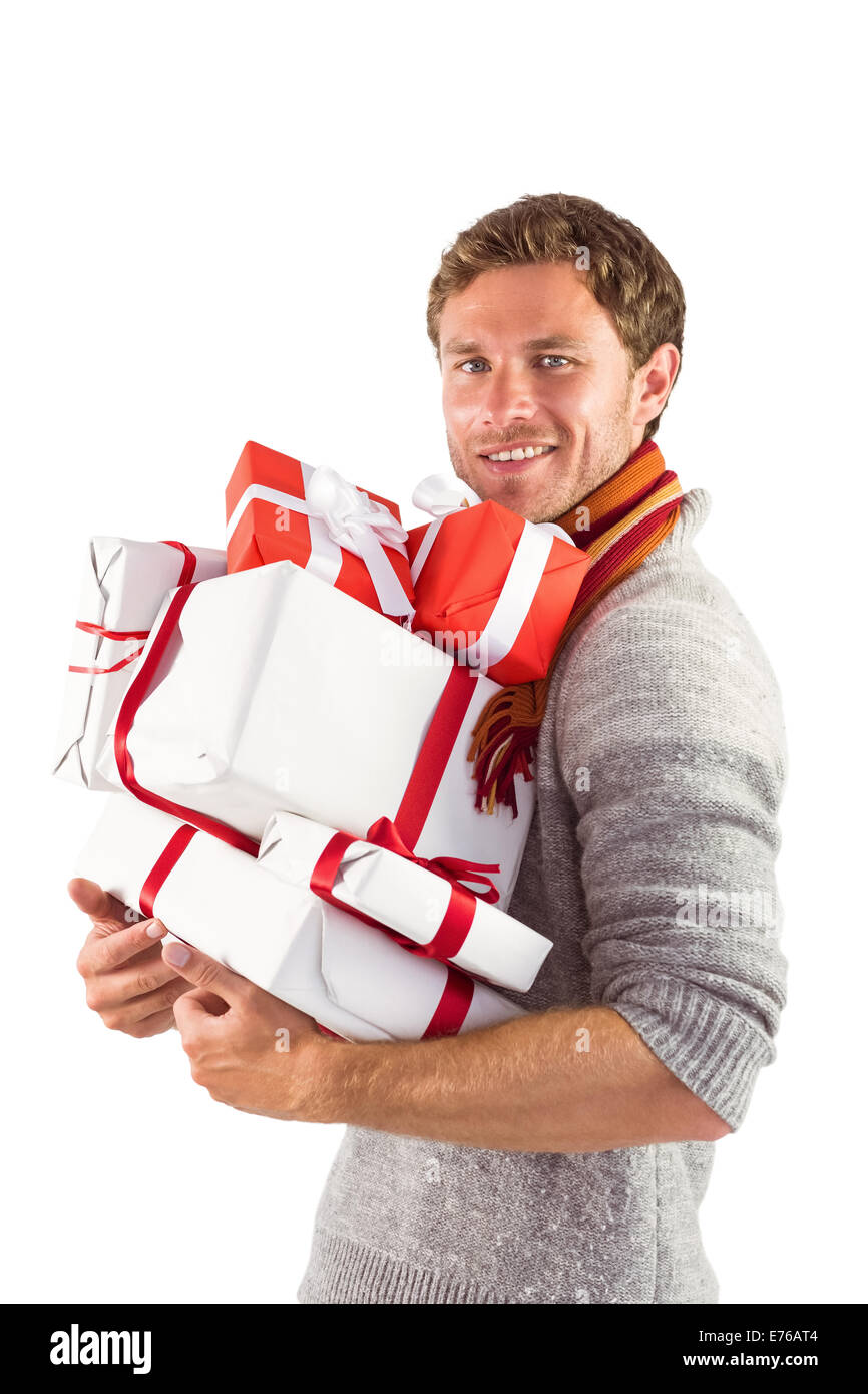 Man holding some large presents Stock Photo - Alamy