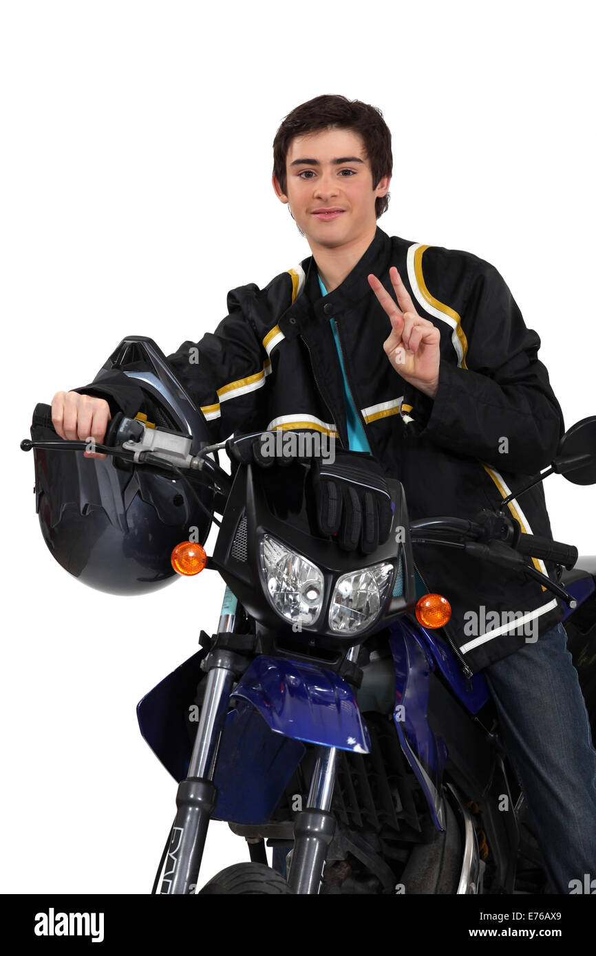 Boy posing with his motorcycle Stock Photo - Alamy