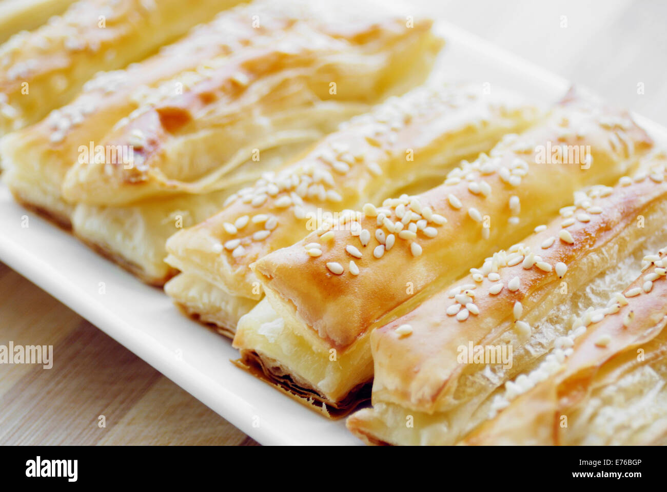 Just baked crunchy puff pastry on the white table Stock Photo - Alamy
