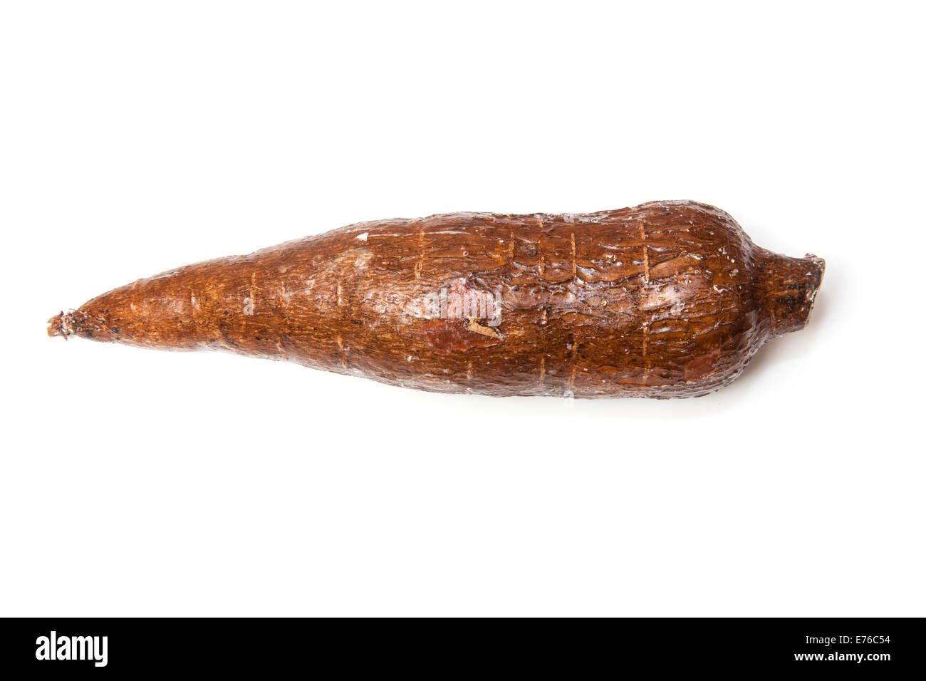 Cassava or Yuca a root vegetable used to make tapioca isolated on a ...