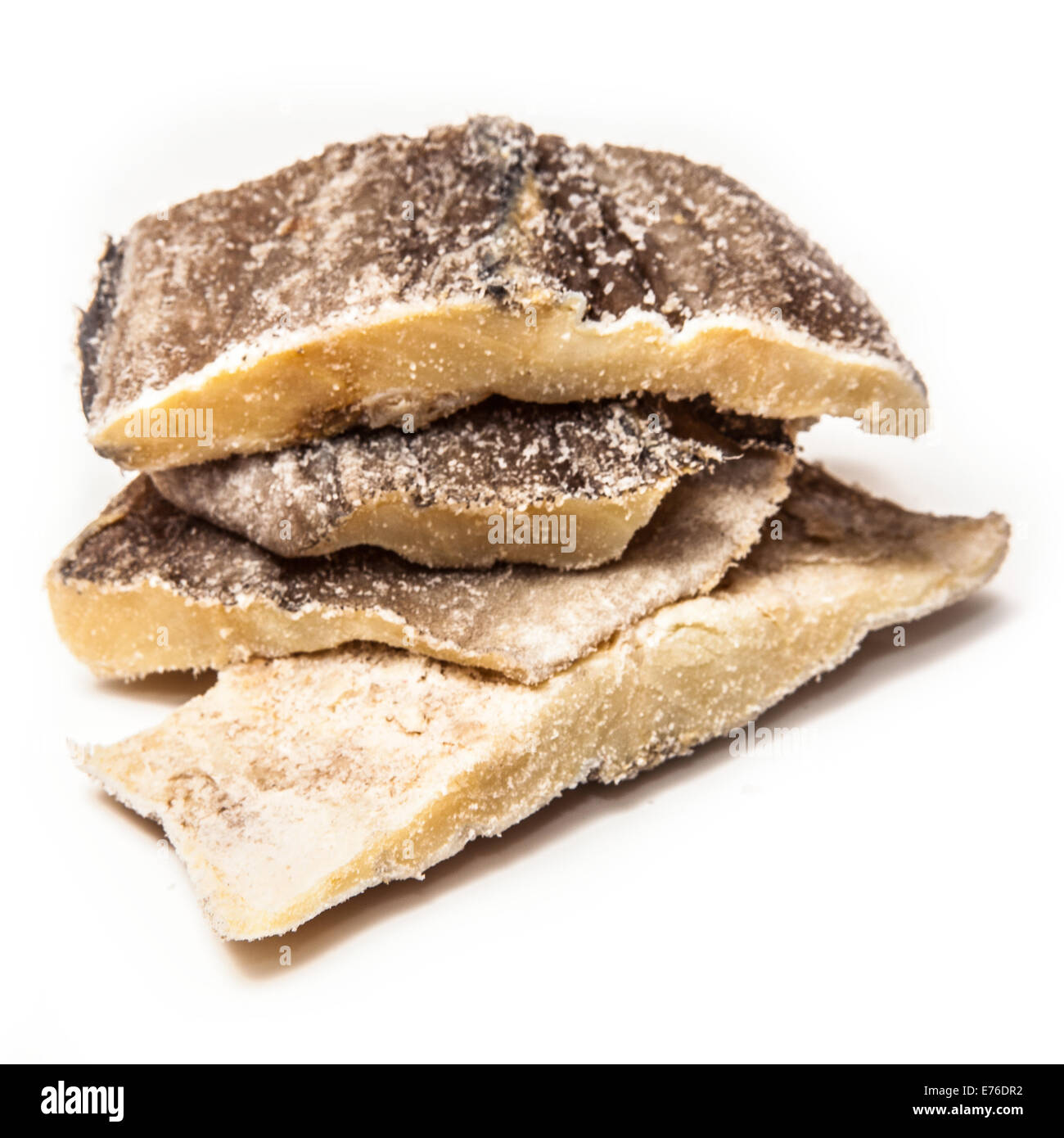 Pieces of salt cod fish isolated on a white studio background Stock ...