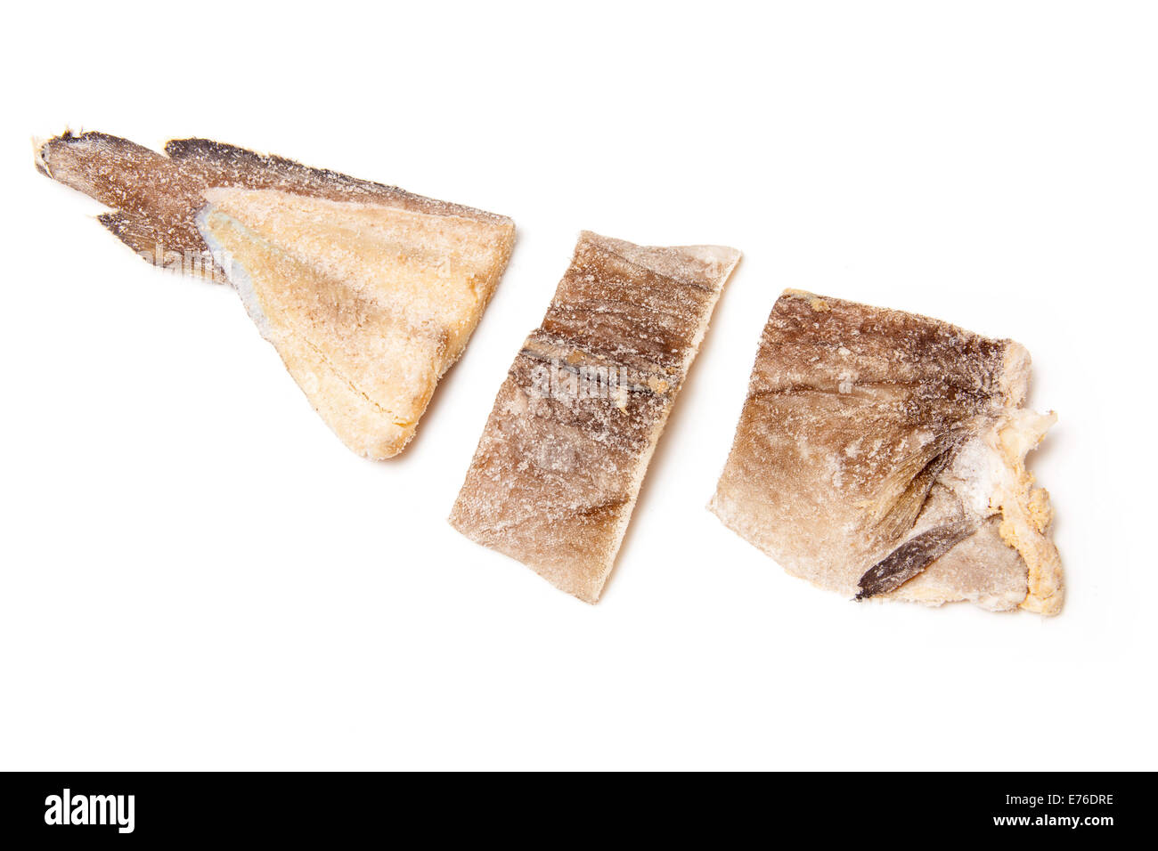 Pieces of salt cod fish isolated on a white studio background Stock ...