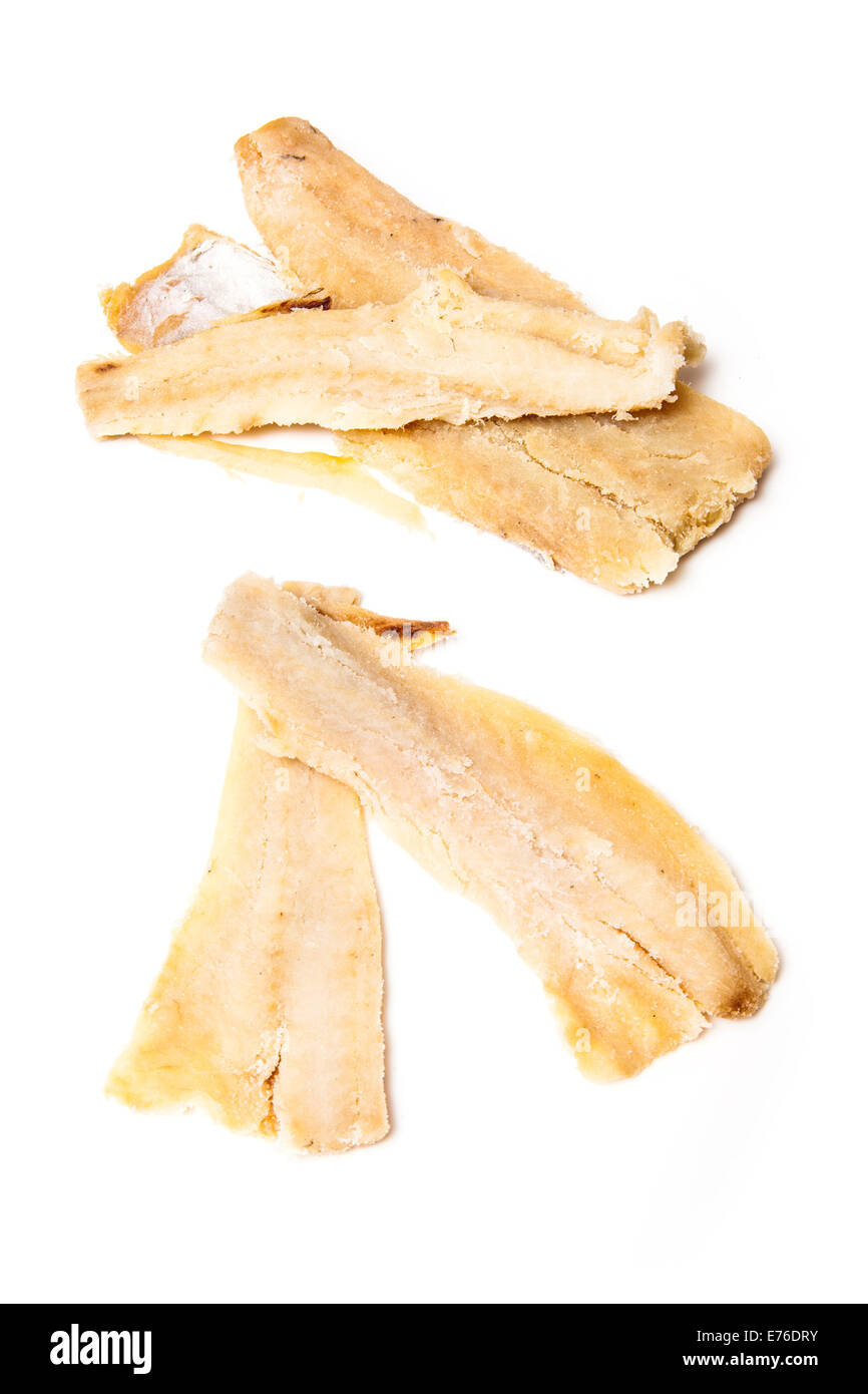 Pieces of salt cod fish isolated on a white studio background Stock ...