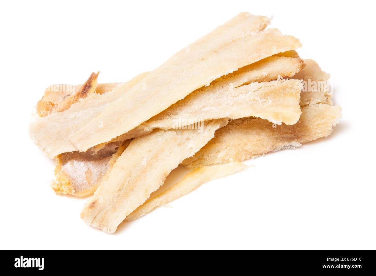 Pieces of salt cod fish isolated on a white studio background Stock ...