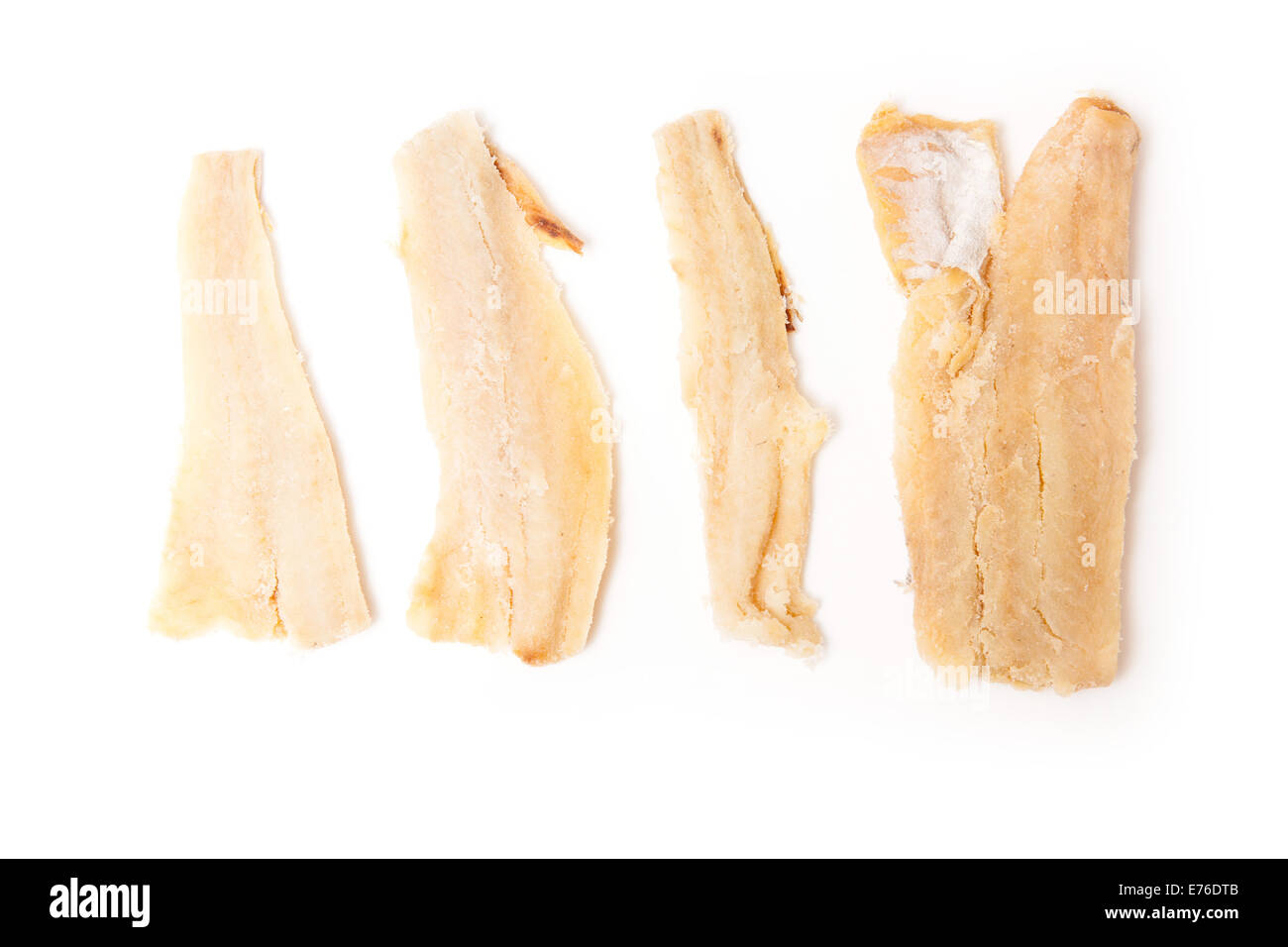 Pieces of salt cod fish isolated on a white studio background Stock ...