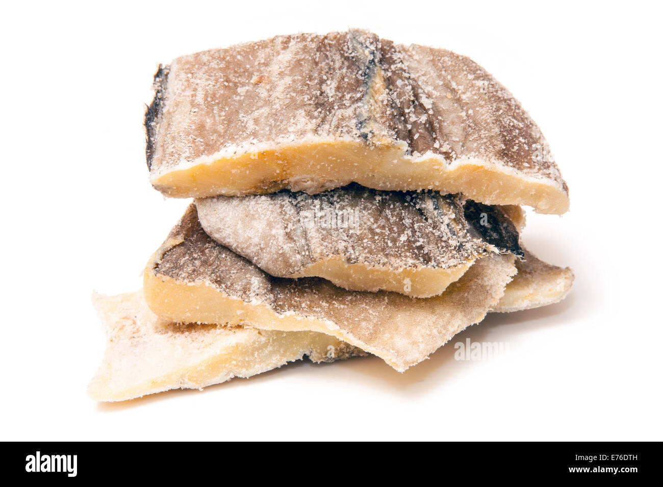 Pieces of salt cod fish isolated on a white studio background Stock ...