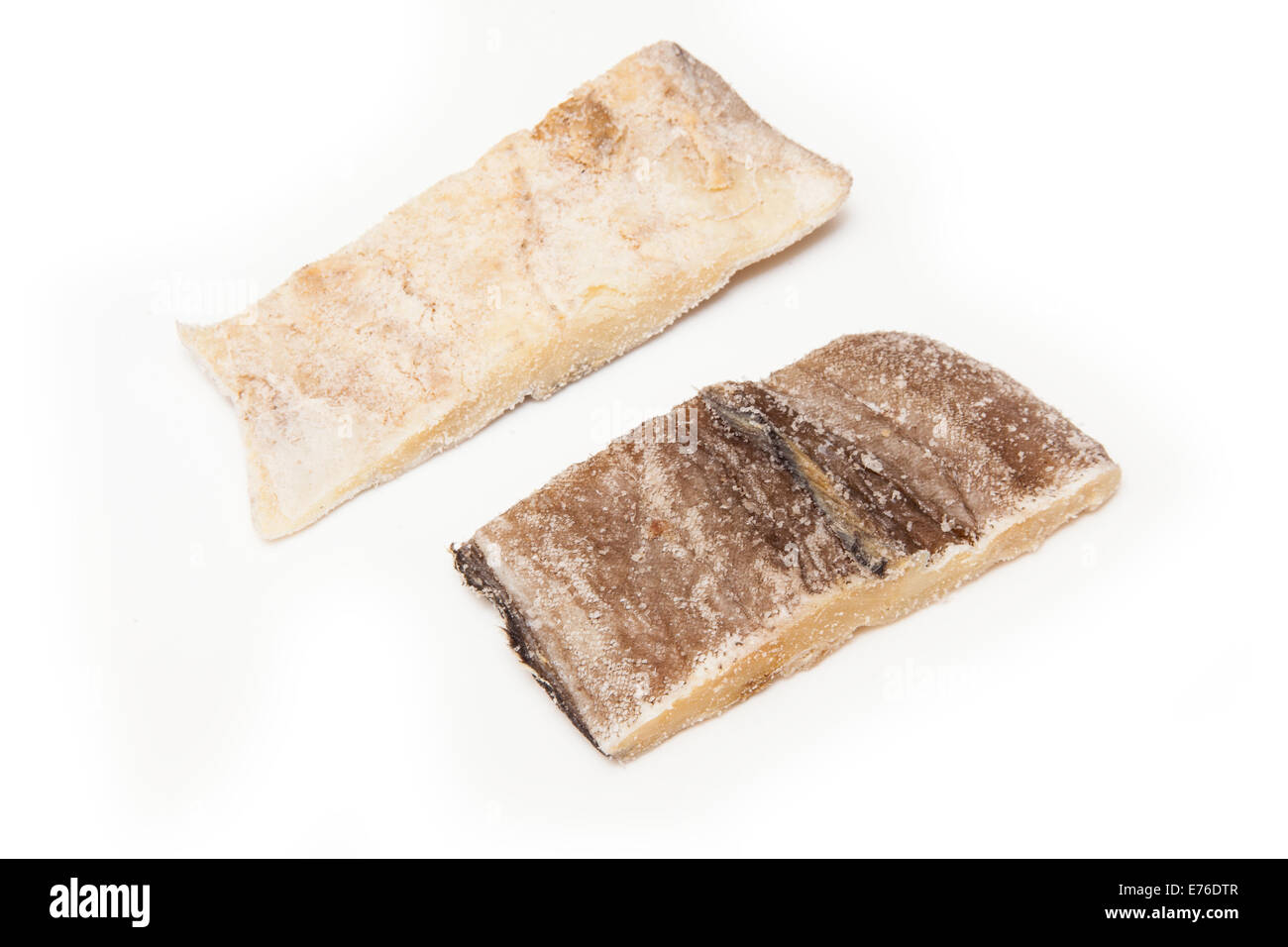 Pieces of salt cod fish isolated on a white studio background Stock ...