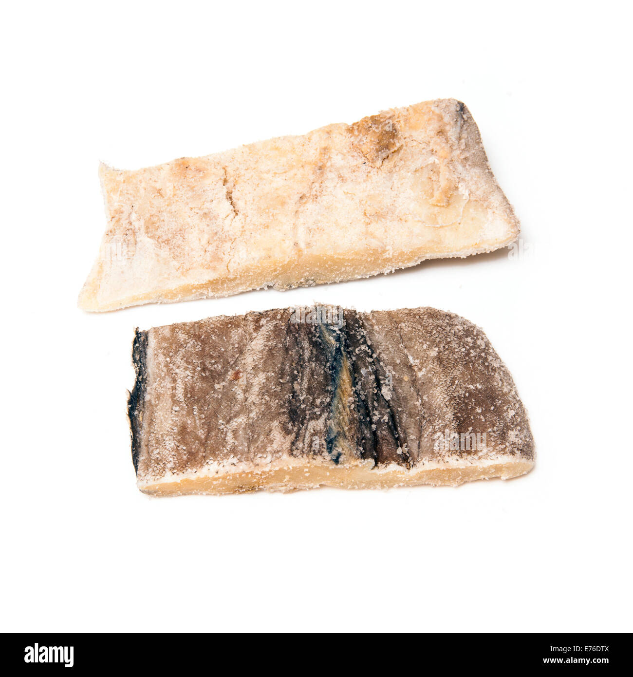 Pieces of salt cod fish isolated on a white studio background Stock ...