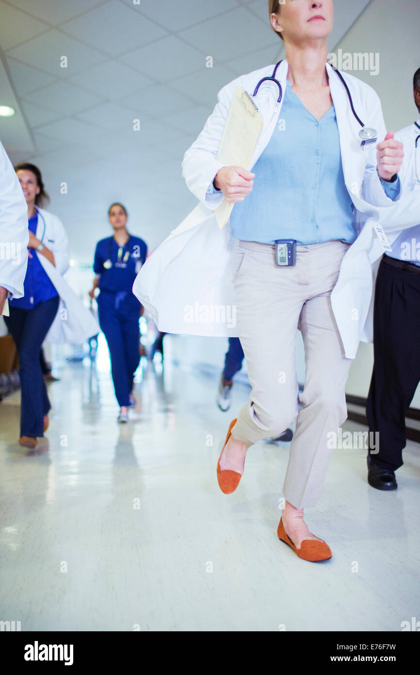 Doctor nurse running down hospital hi-res stock photography and images ...