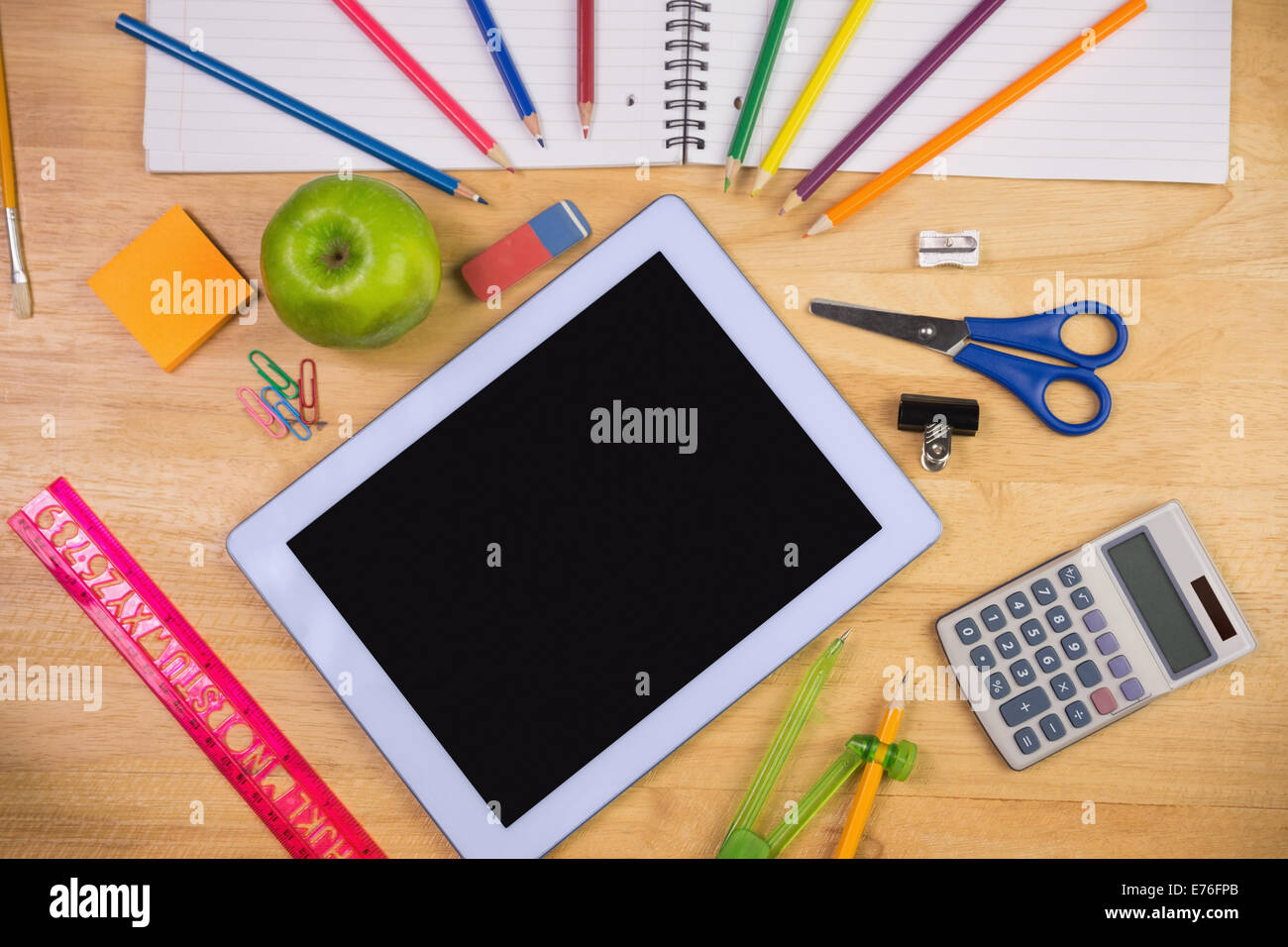 Students table with school supplies Stock Photo - Alamy