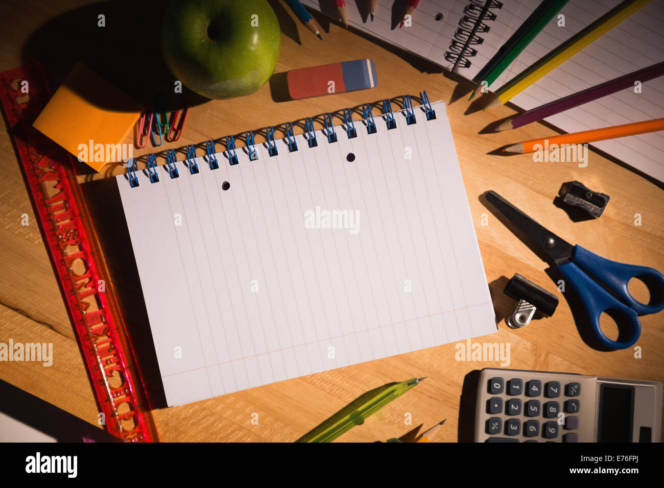 Students table with school supplies Stock Photo - Alamy