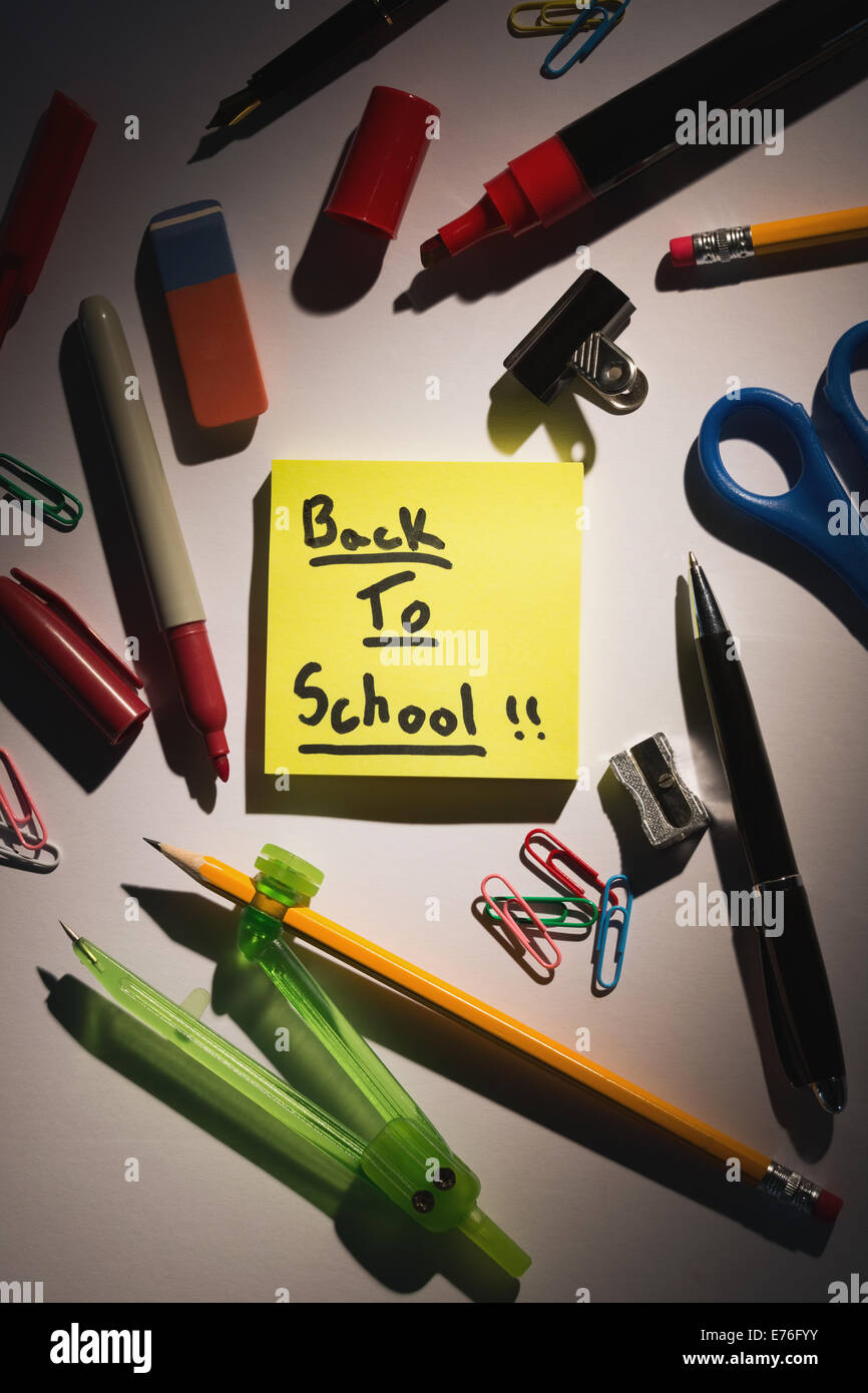 Students table with school supplies Stock Photo - Alamy