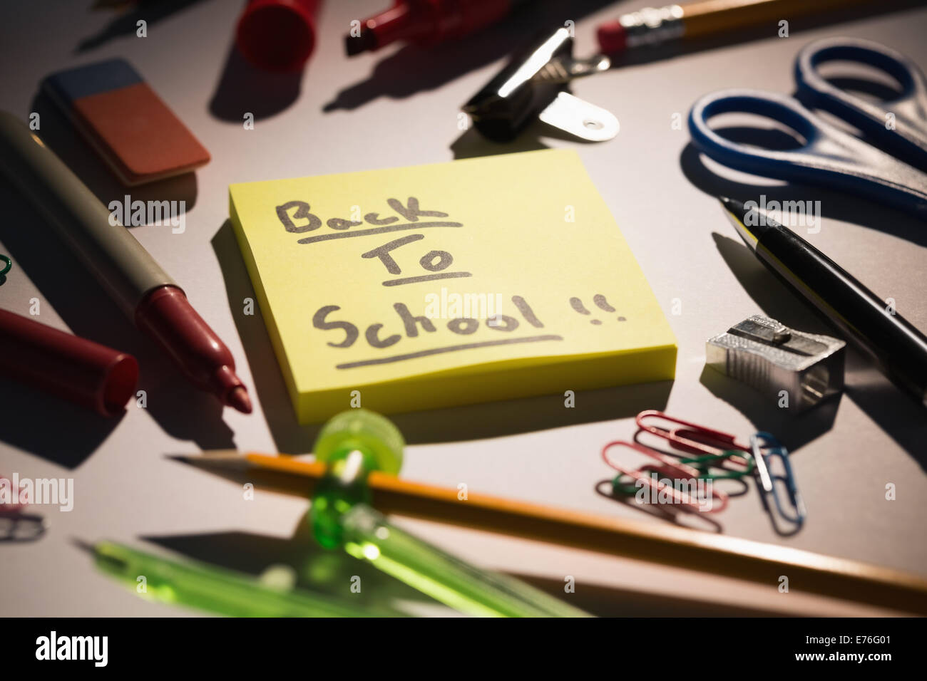 Students table with school supplies Stock Photo - Alamy