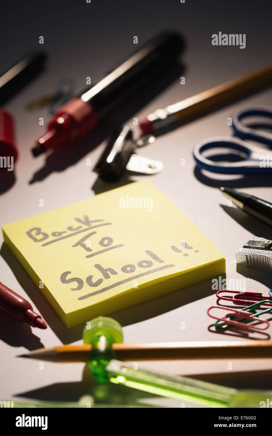Students table with school supplies Stock Photo - Alamy