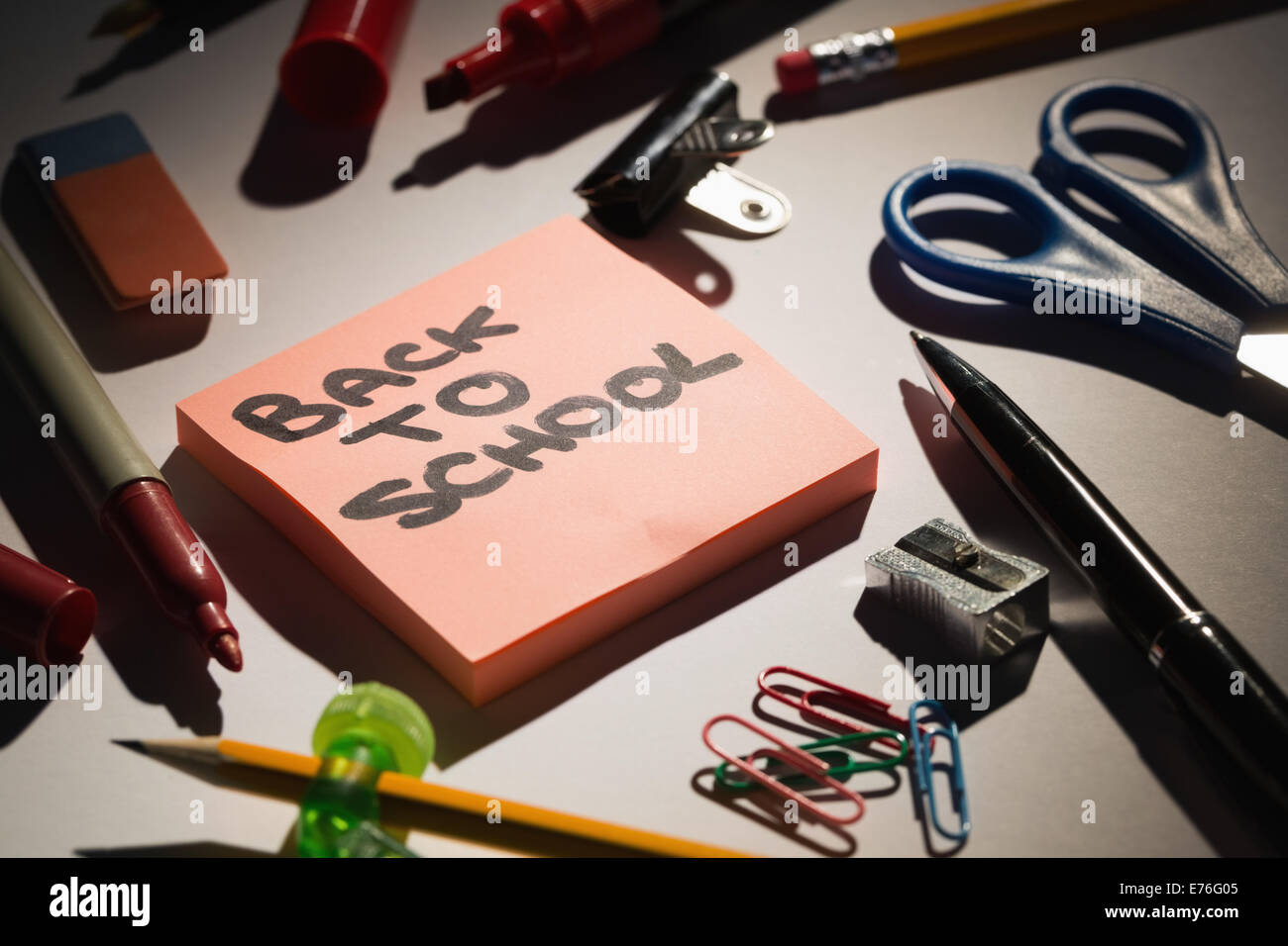 Students table with school supplies Stock Photo - Alamy