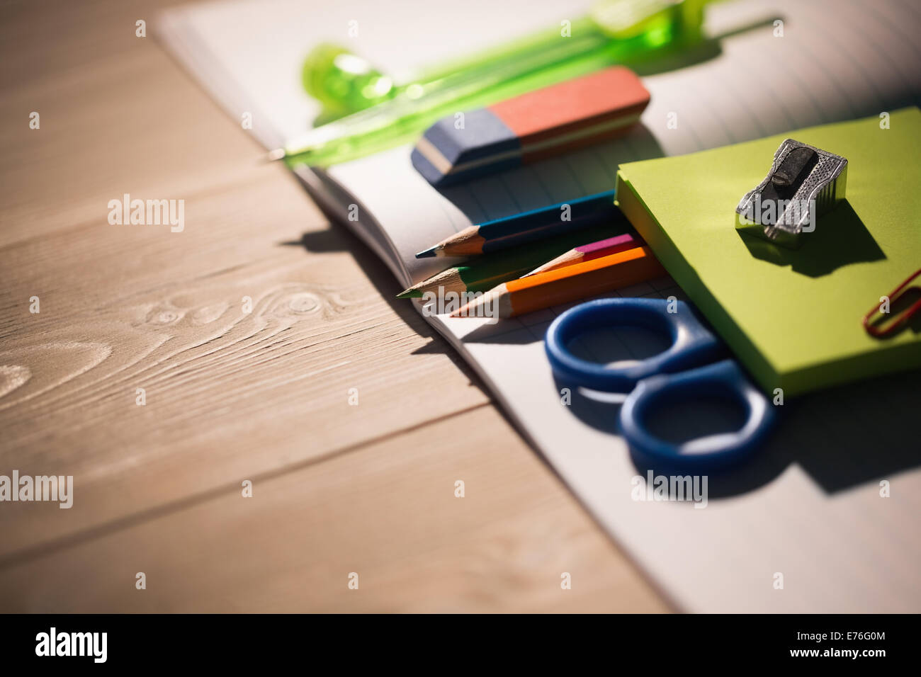 Students table with school supplies Stock Photo - Alamy