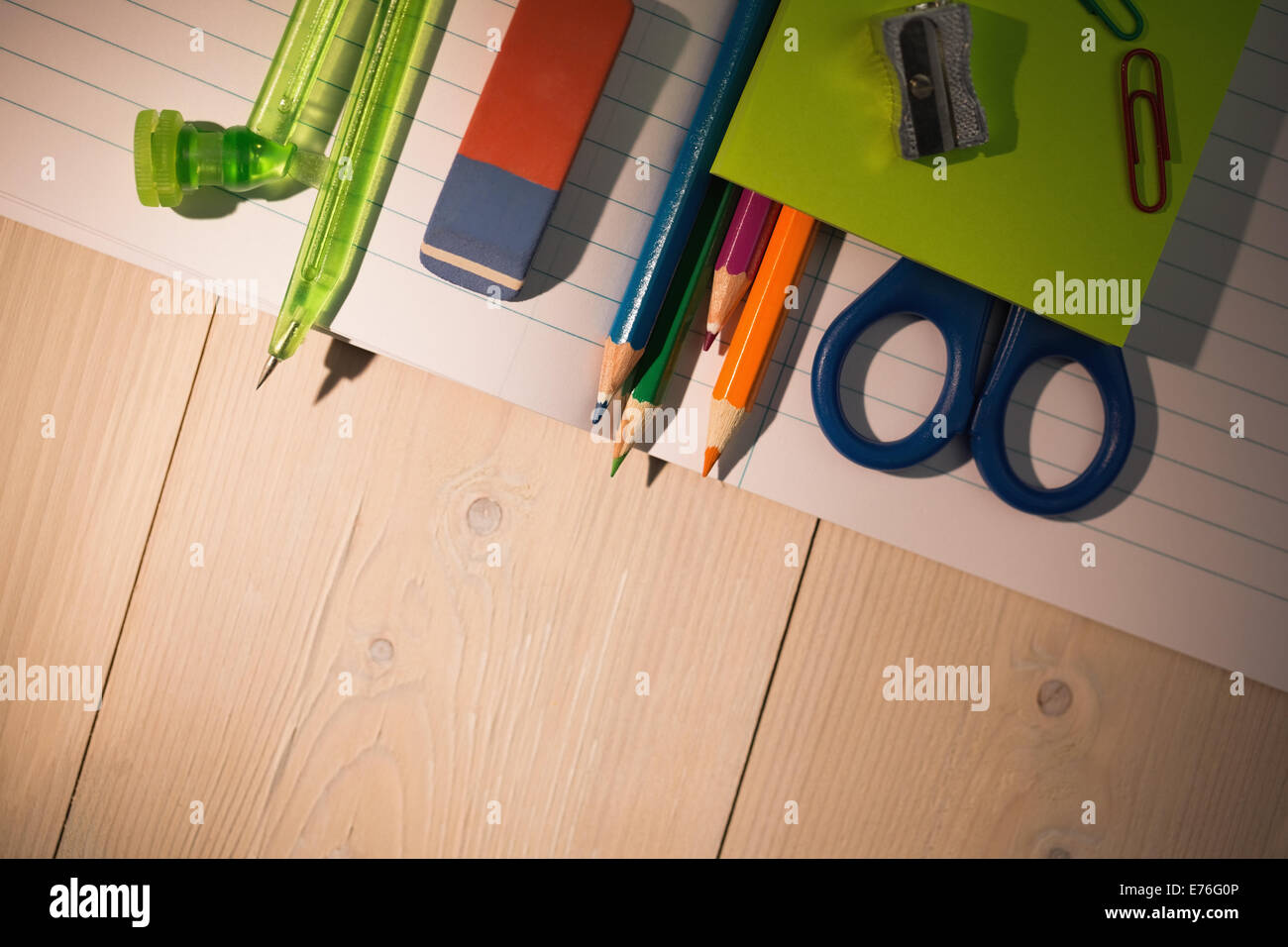 Students table with school supplies Stock Photo - Alamy