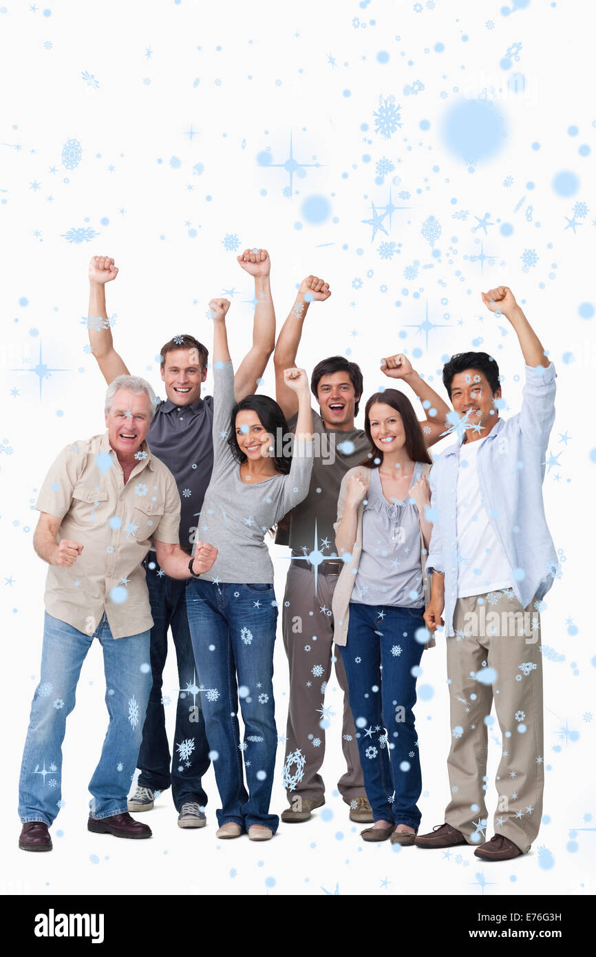 Composite image of cheering group of people Stock Photo - Alamy