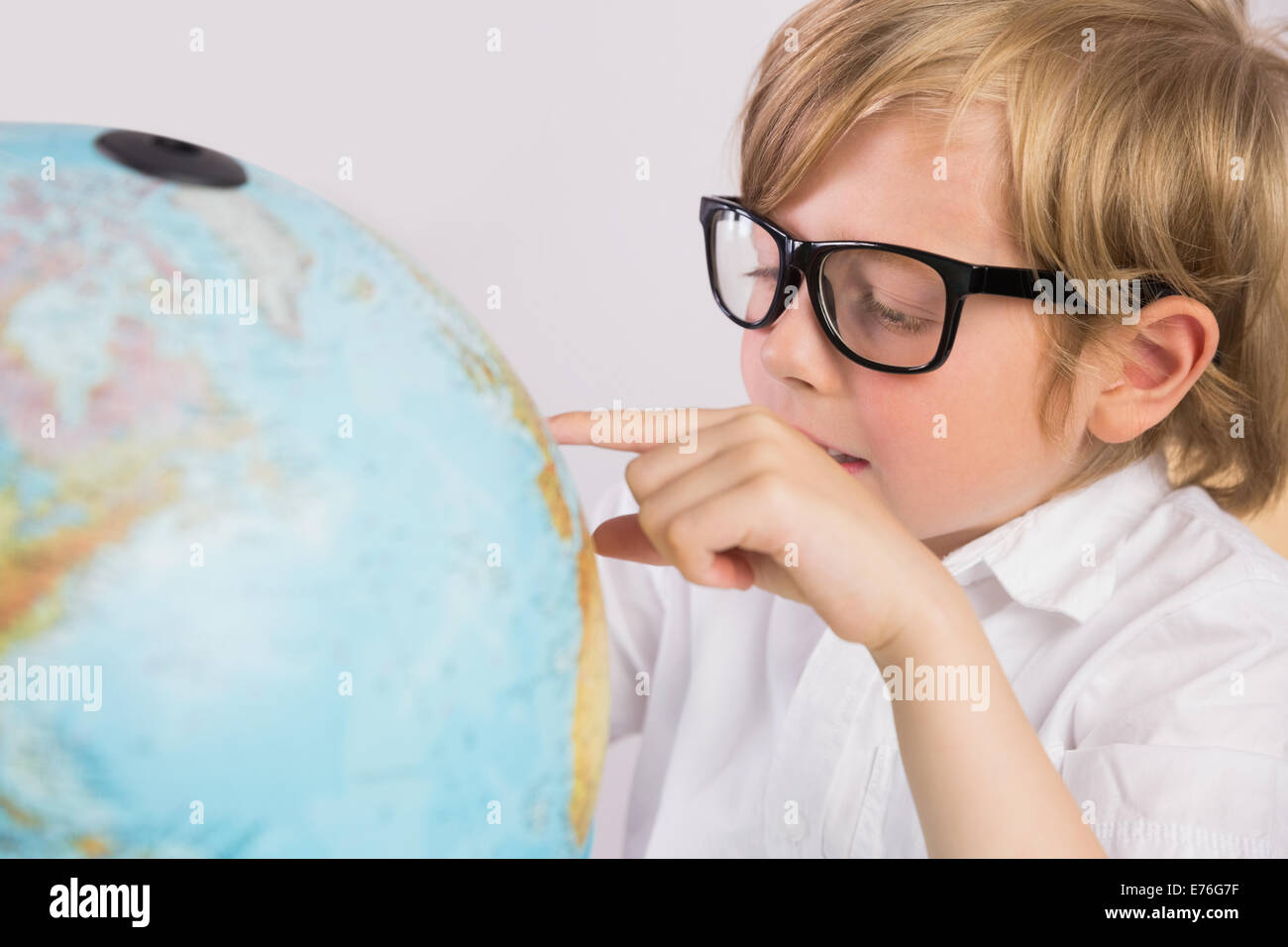 Student learning geography with globe Stock Photo - Alamy