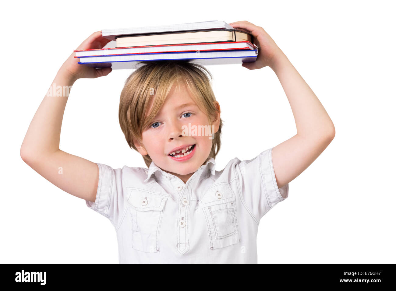 Student balancing books on his head Stock Photo - Alamy