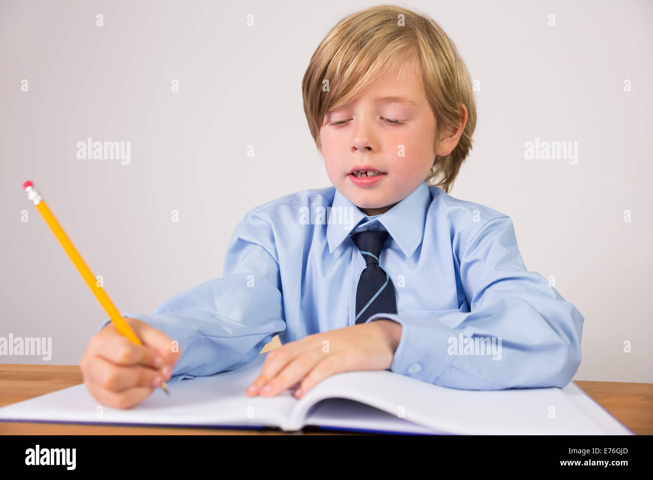 Student writing notes in notepad Stock Photo - Alamy