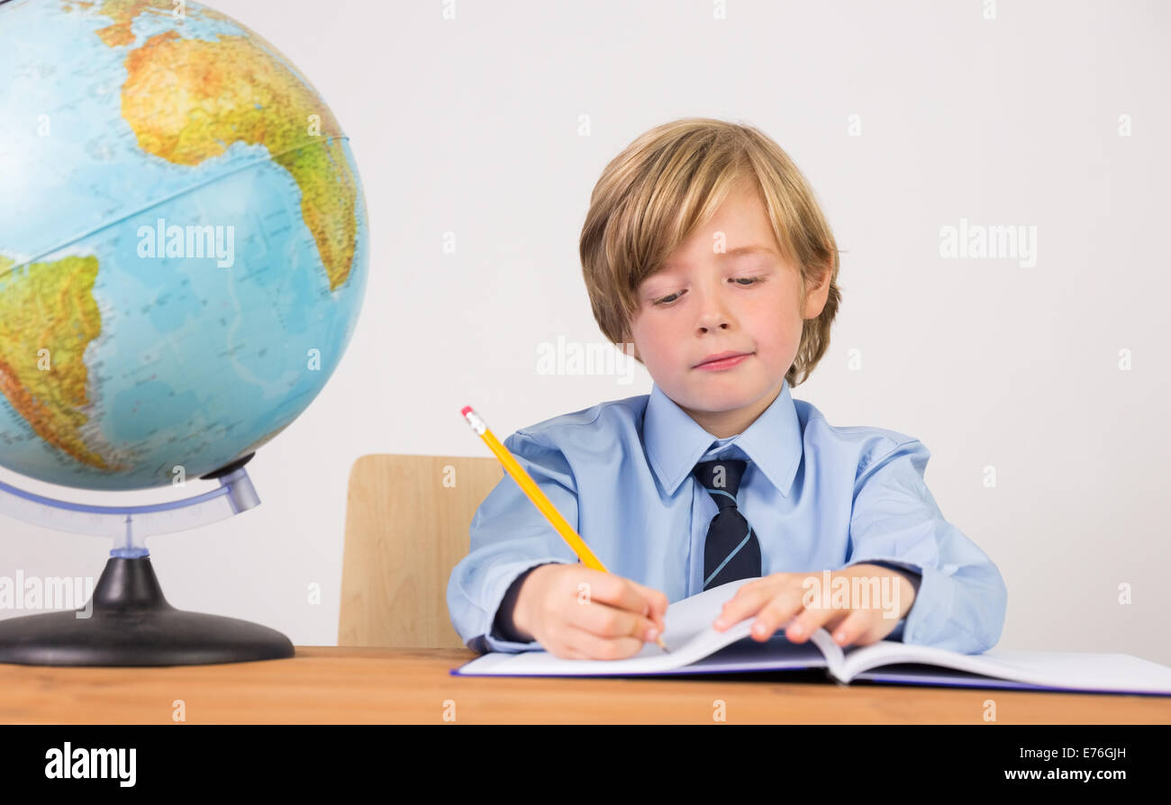 Student writing notes in notepad Stock Photo - Alamy