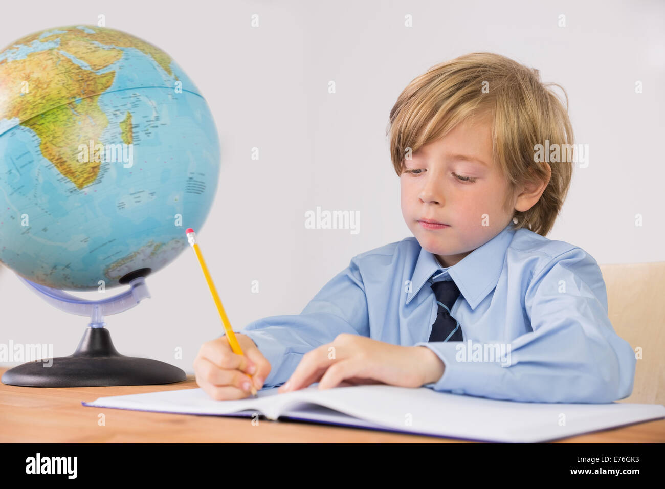 Student writing notes in notepad Stock Photo - Alamy