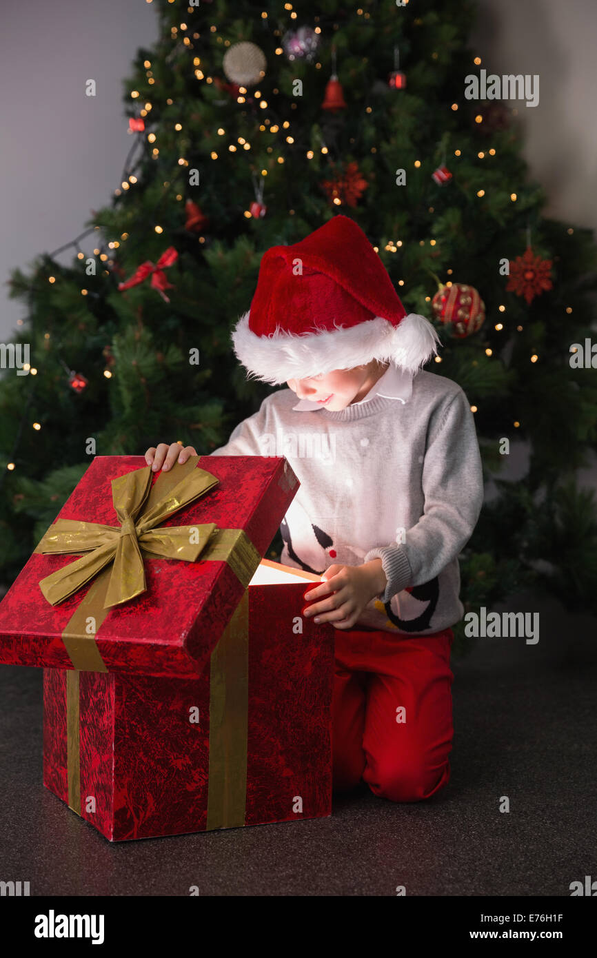 Child opening his christmas present Stock Photo - Alamy