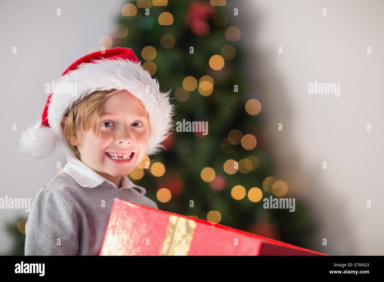 Child opening his christmas present Stock Photo - Alamy