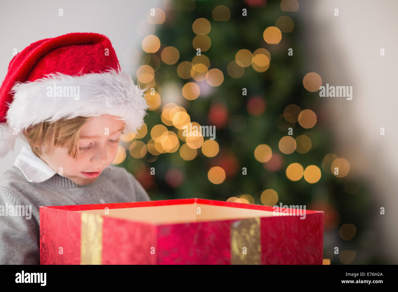 Child opening his christmas present Stock Photo - Alamy