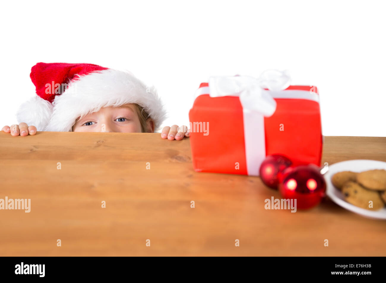 Child looking at christmas present Stock Photo - Alamy