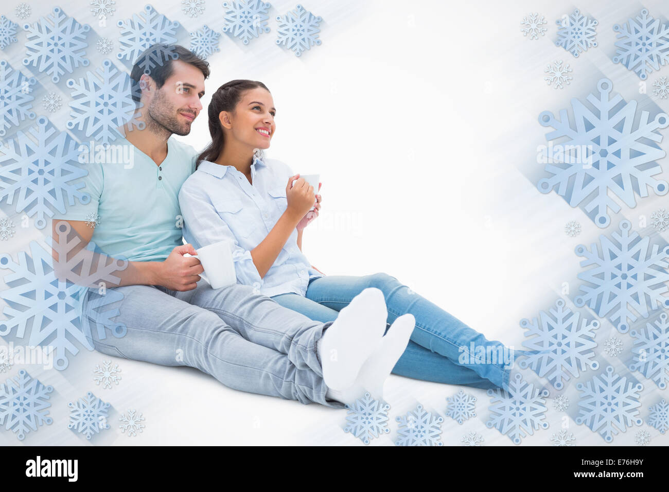 Composite image of cute couple sitting having coffee Stock Photo - Alamy