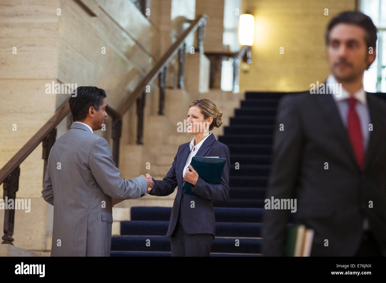 Indian woman shaking hands hi-res stock photography and images - Alamy