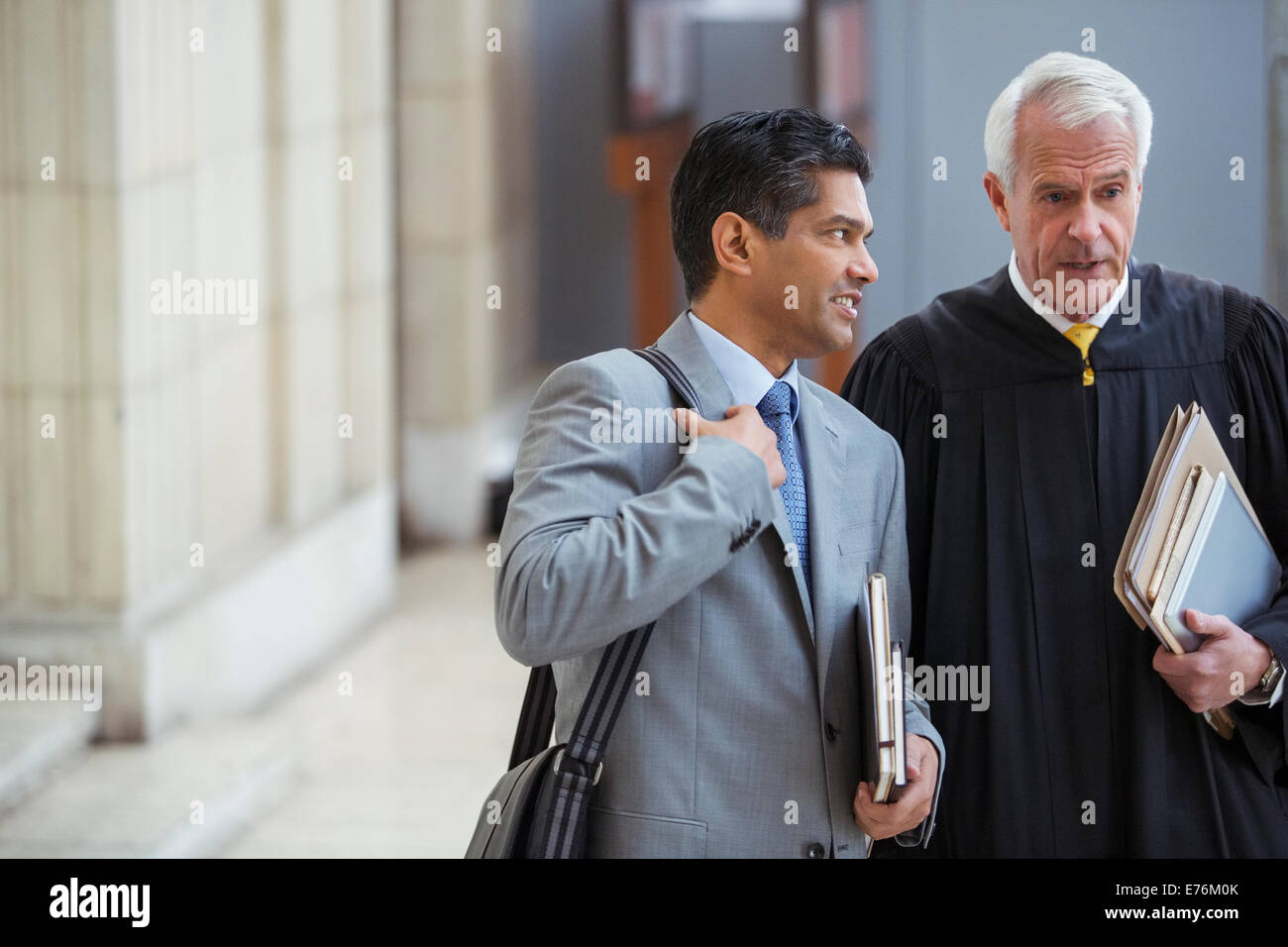 Judge and lawyer talking in courthouse Stock Photo - Alamy