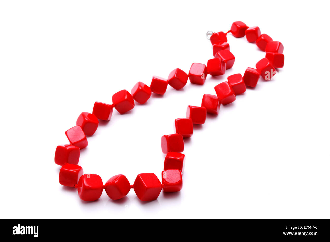 Red cubic beads on a white background with reflexion Stock Photo - Alamy