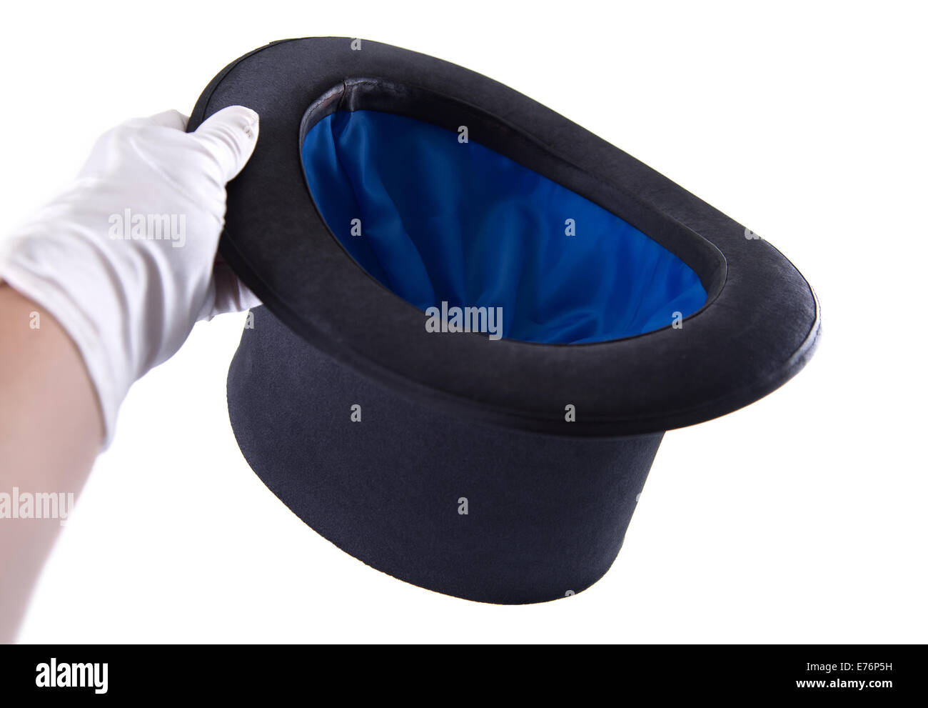 Magician hand in white glove holding classic top hat, isolated on white ...