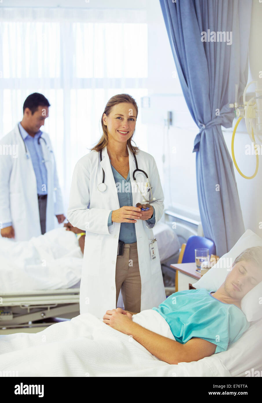 Doctor smiling in hospital room Stock Photo - Alamy