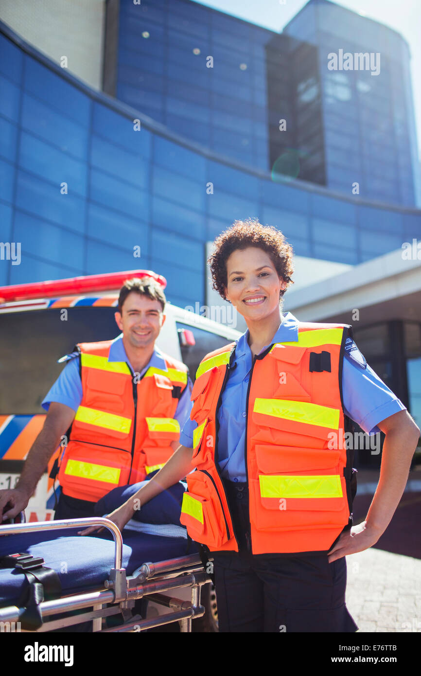 Paramedics smiling outside hospital Stock Photo - Alamy