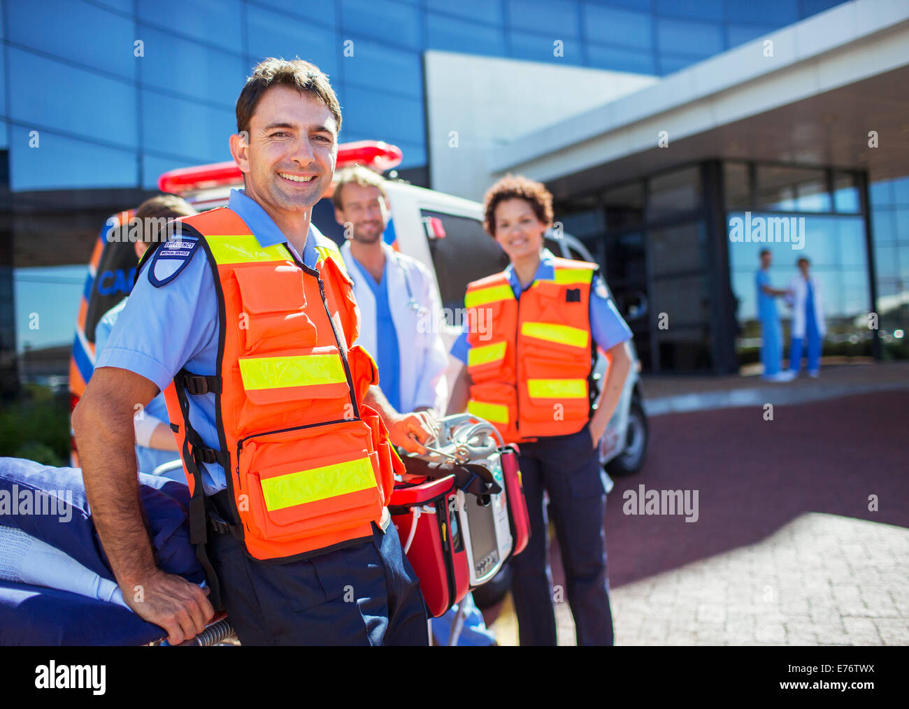 Paramedics smiling outside hospital Stock Photo - Alamy