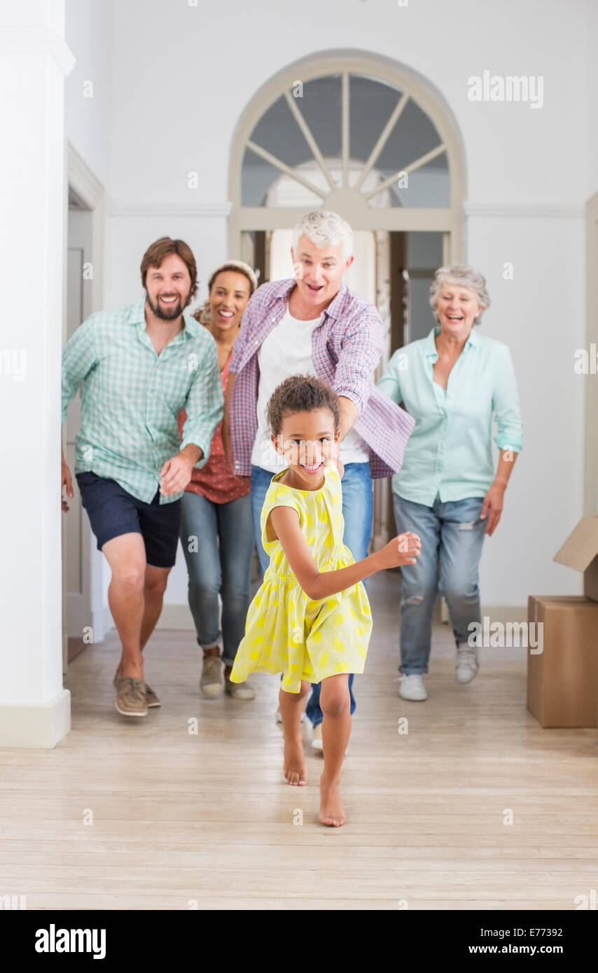 Family running through home together Stock Photo - Alamy